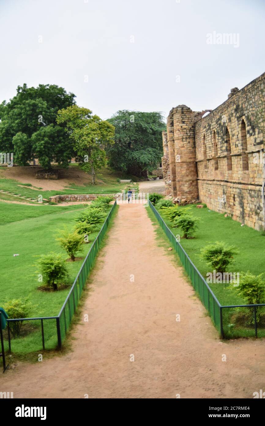 Inside the Qutub Minar Complex with antic ruins and inner square ...
