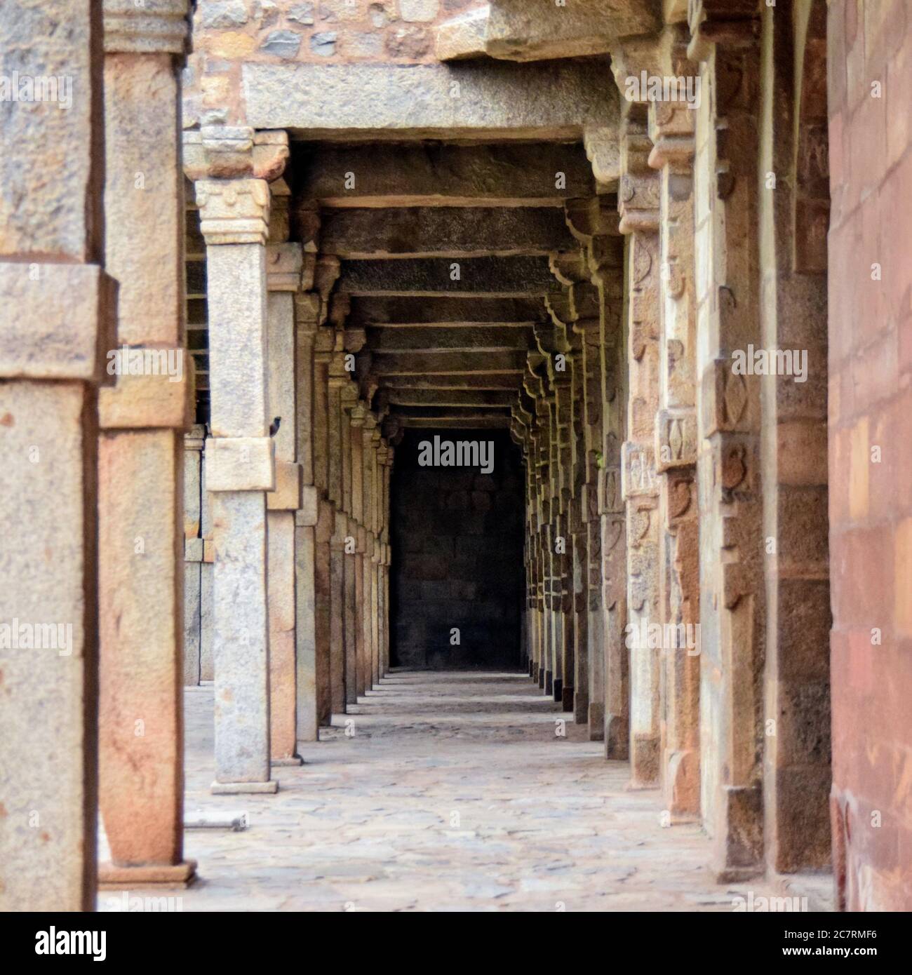 Inside the Qutub Minar Complex with antic ruins and inner square ...