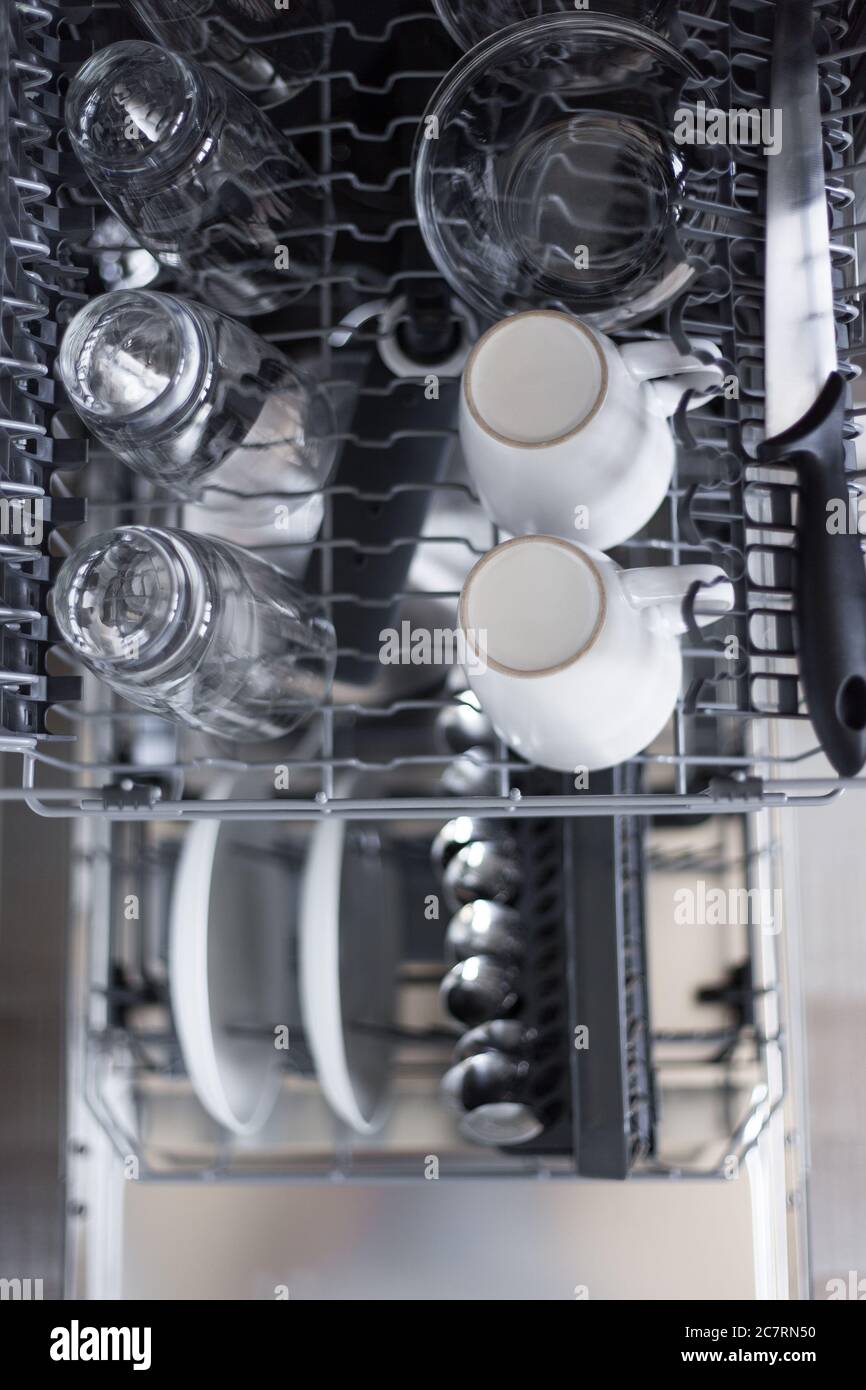 top view of utensils in modern dishwasher after cleaning process Stock ...