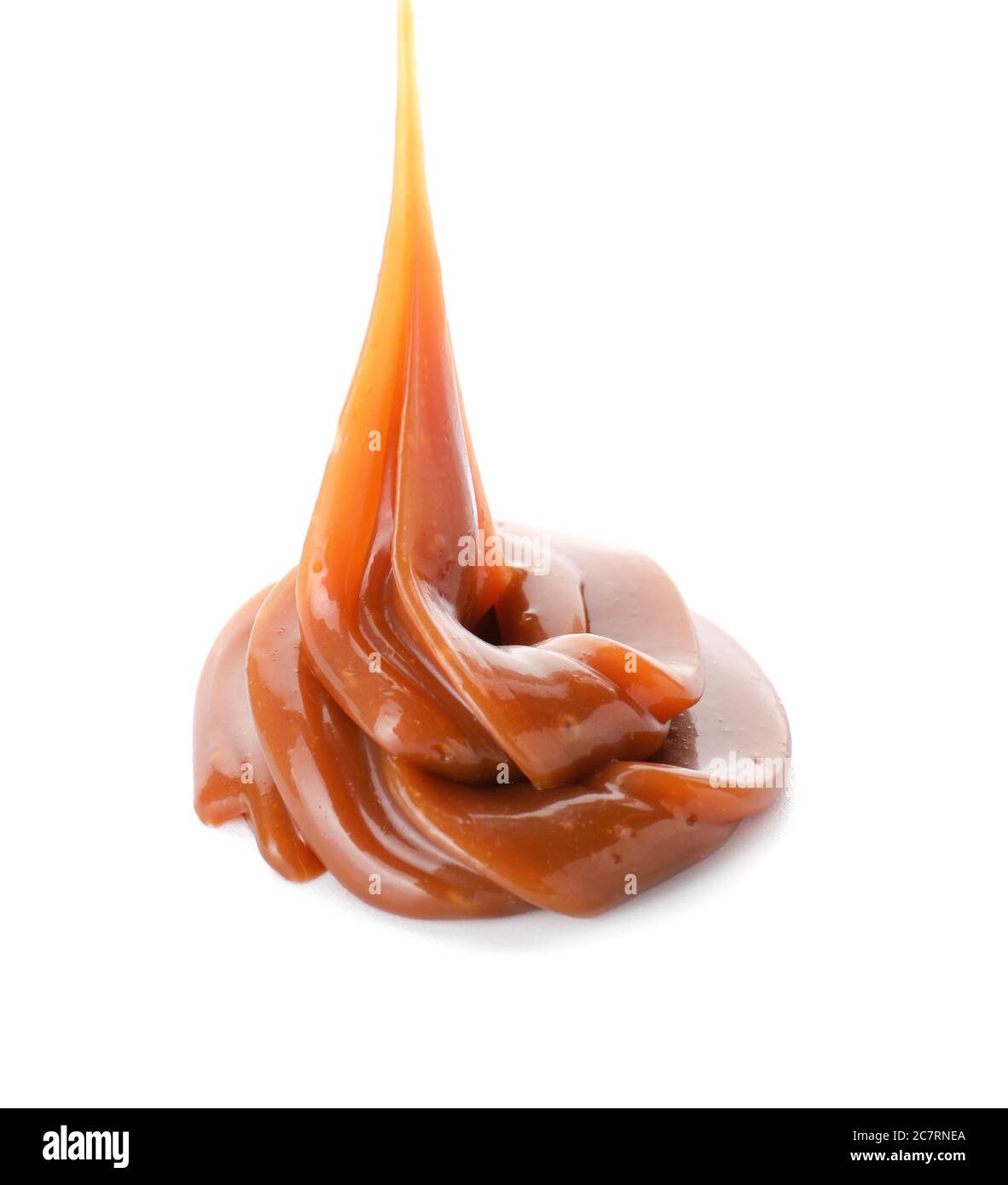 Liquid caramel on white background Stock Photo - Alamy
