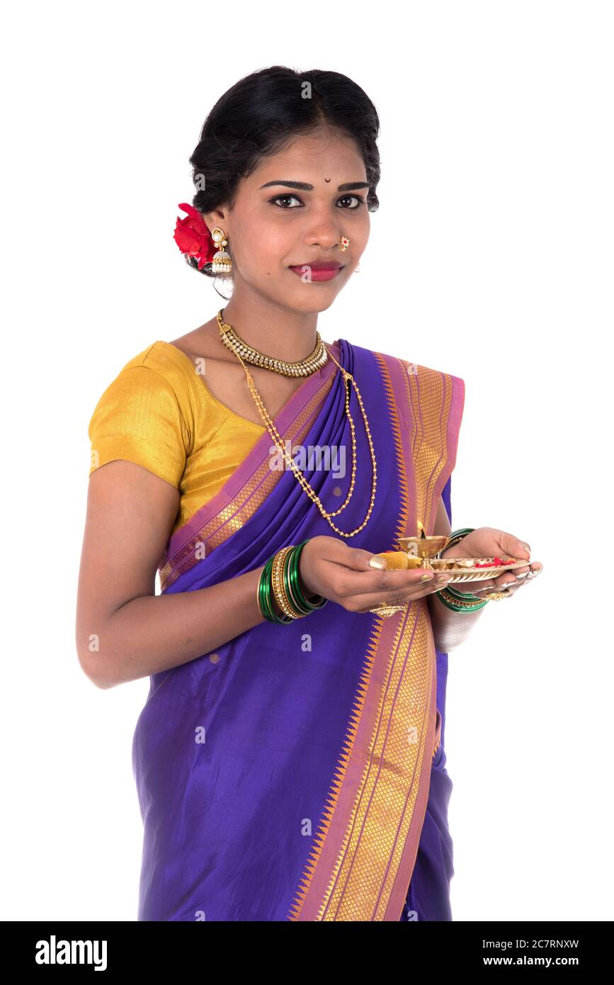 Indian woman performing worship, portrait of a beautiful young lady ...