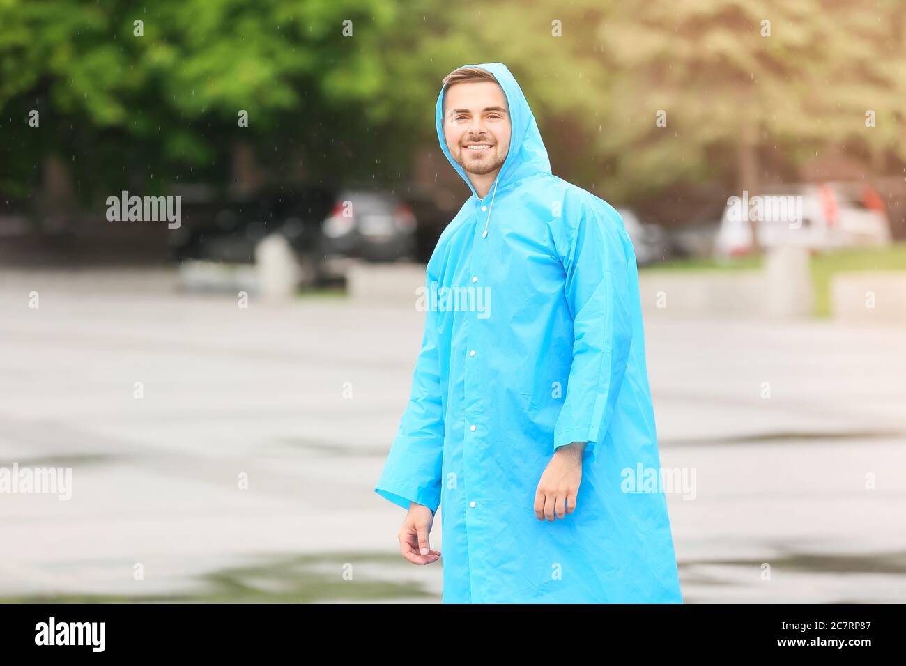 Man wearing raincoat hi-res stock photography and images - Alamy