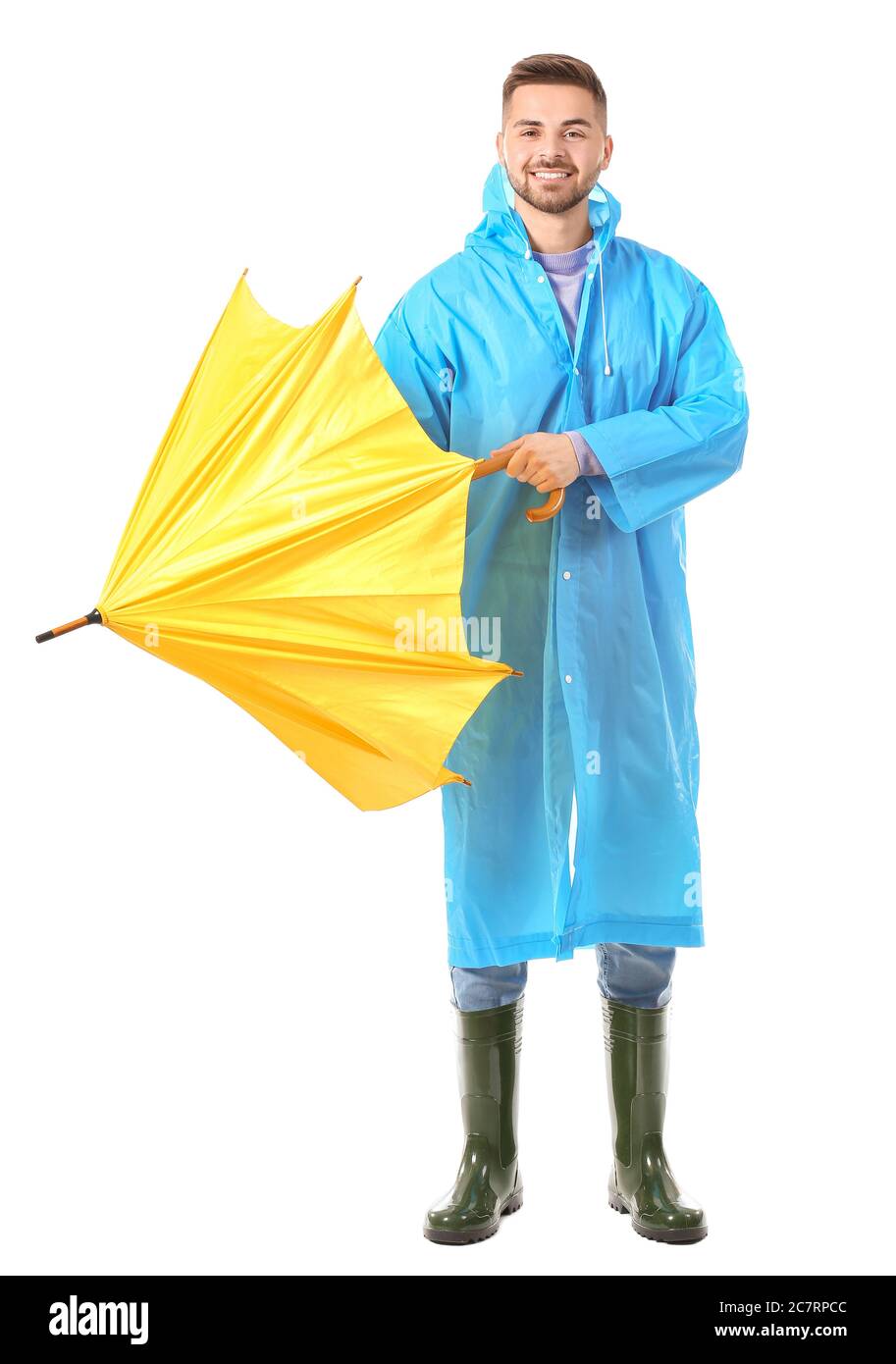 Young man in raincoat and with umbrella on white background Stock Photo ...