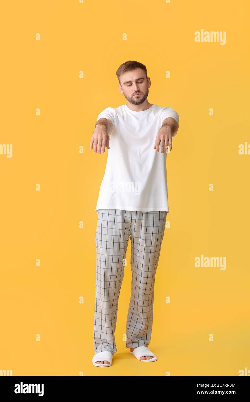 Male sleepwalker on color background Stock Photo - Alamy