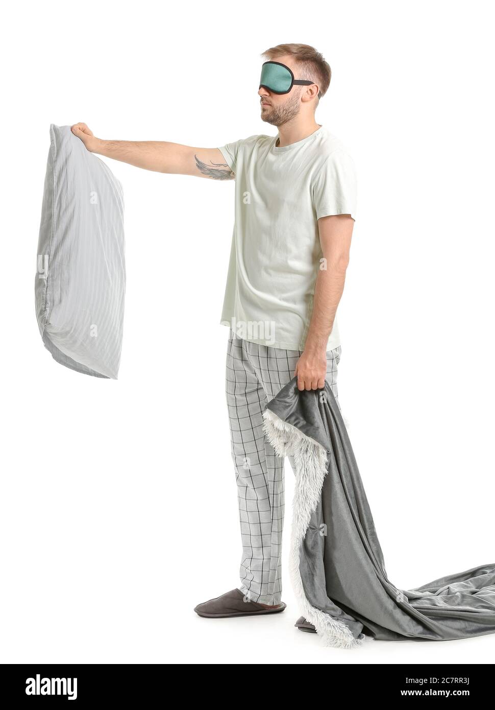 Male sleepwalker on white background Stock Photo - Alamy