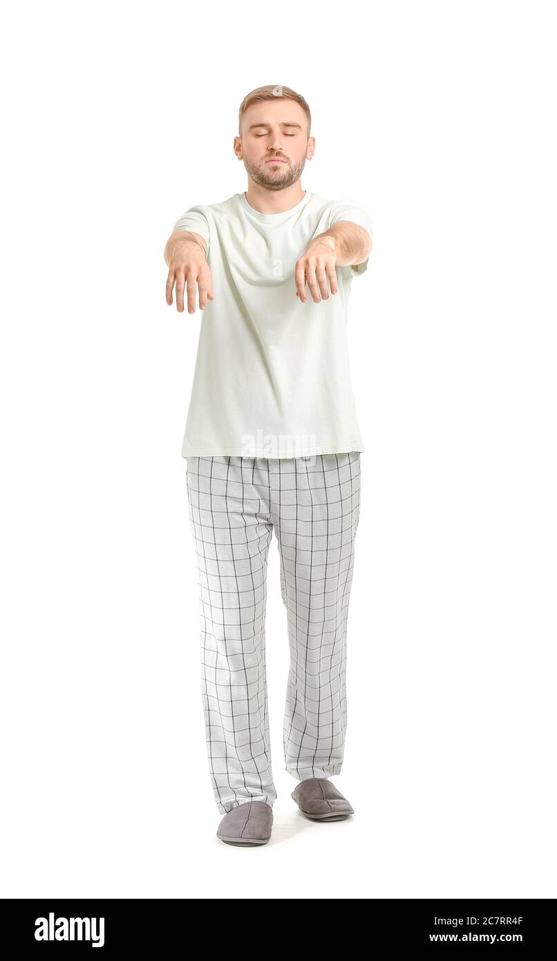 Male sleepwalker on white background Stock Photo - Alamy
