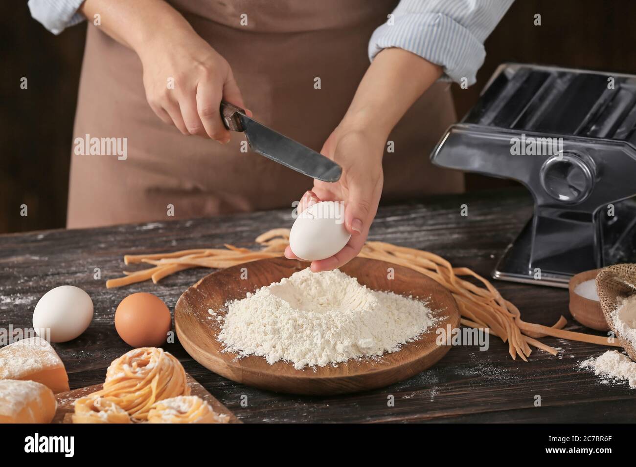 Woman preparing pasta in kitchen, closeup Stock Photo - Alamy