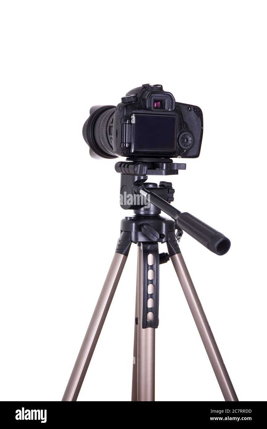 modern dslr camera with blank screen on tripod isolated on white ...