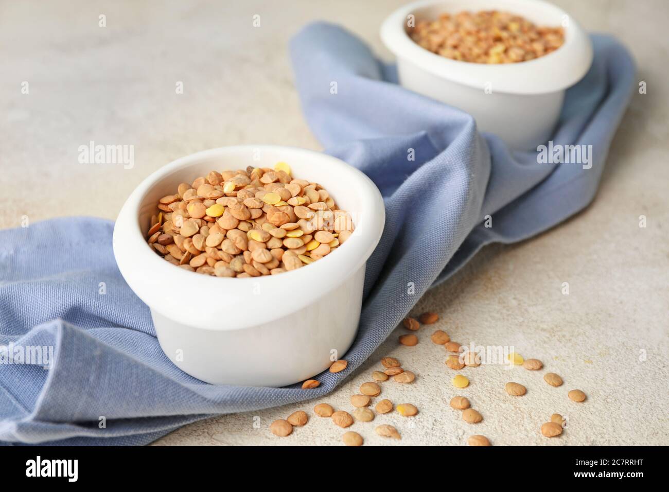 Raw lentils in bowls on table Stock Photo - Alamy