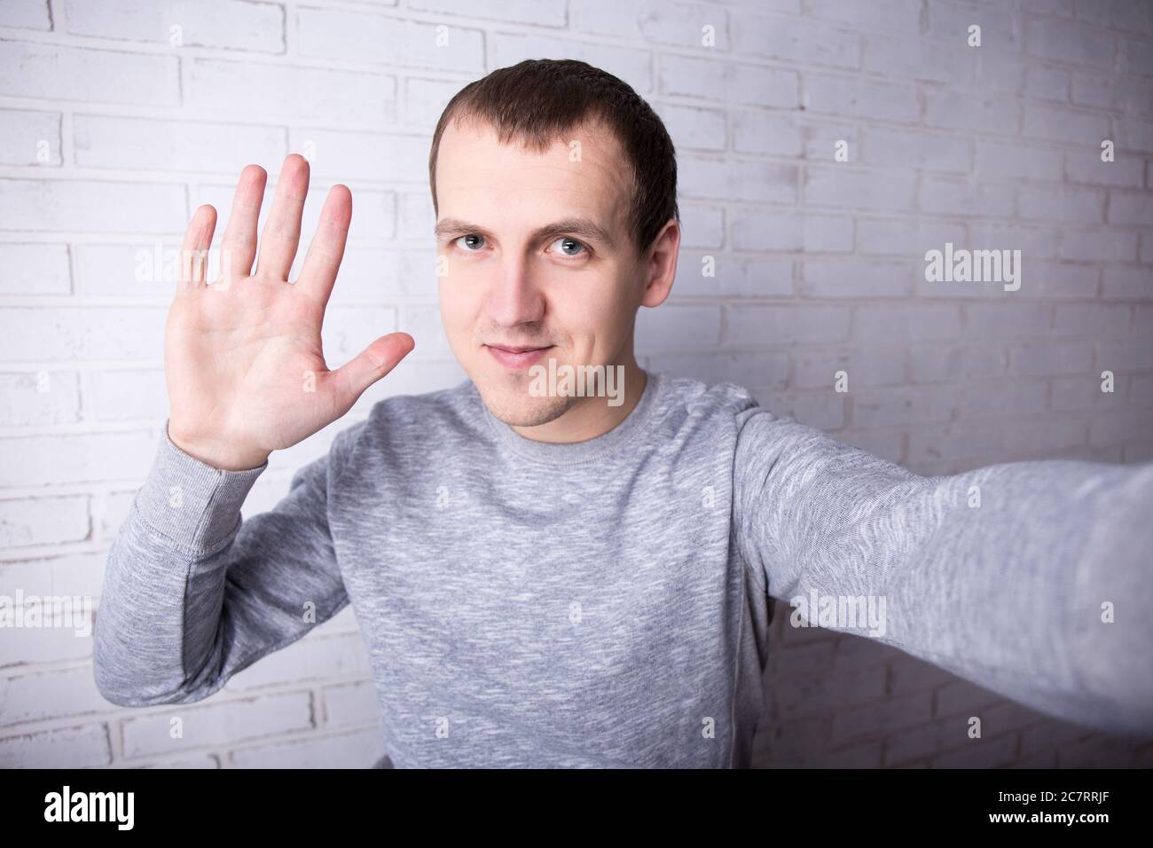 happy young handsome man taking selfie picture or recording video for ...