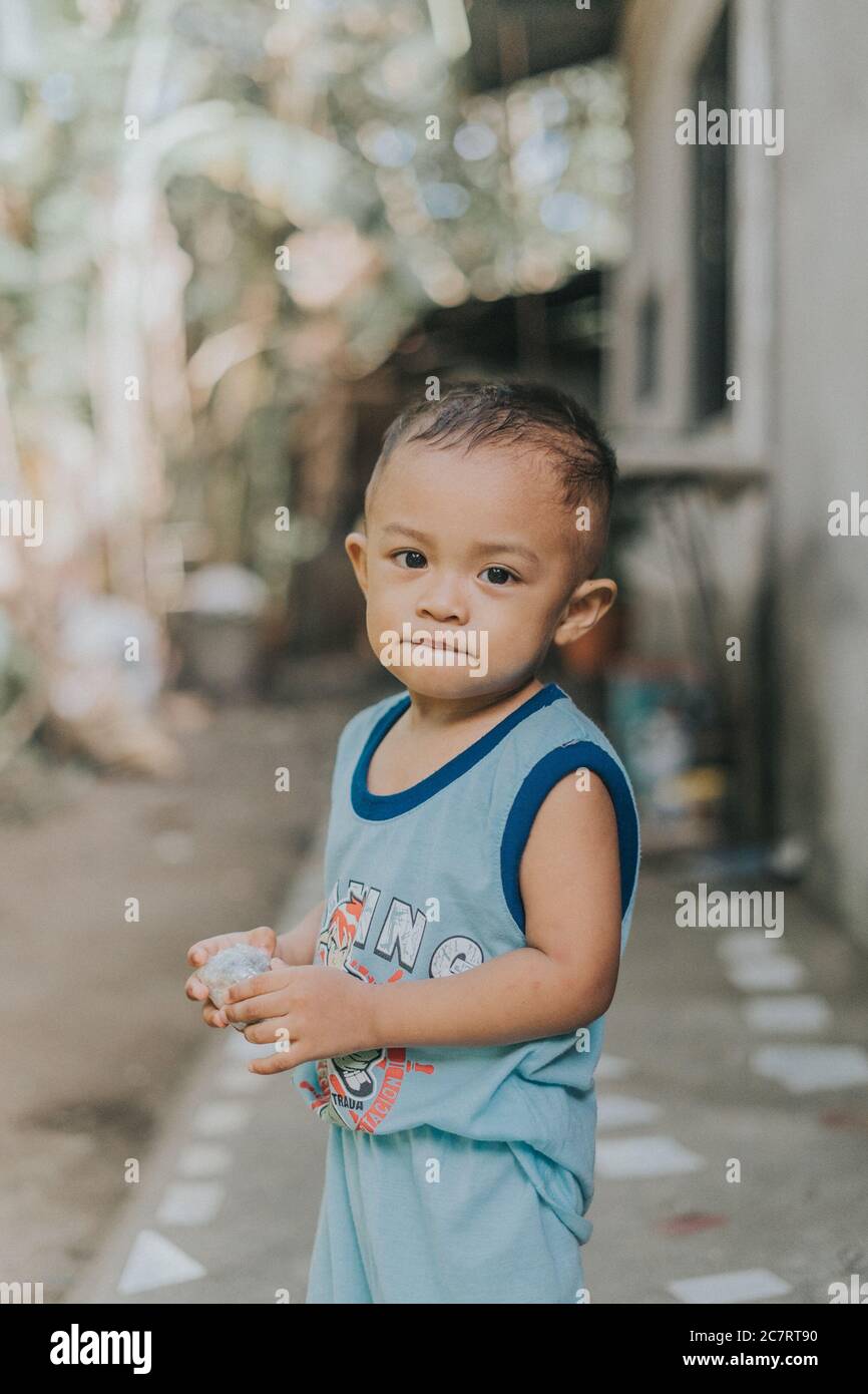 Portrait of a Cute and Happy Little Filipino Kid Smilling in to the ...