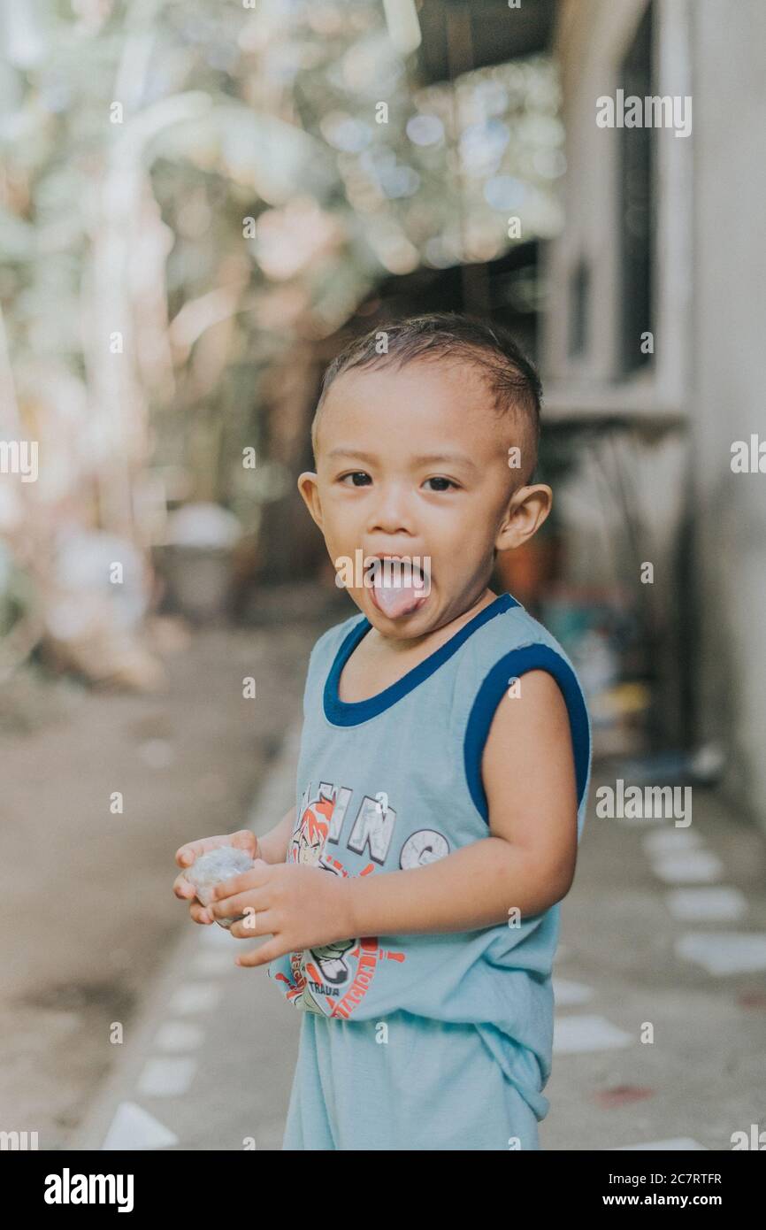 Portrait of a Cute and Happy Little Filipino Kid Smilling in to the ...