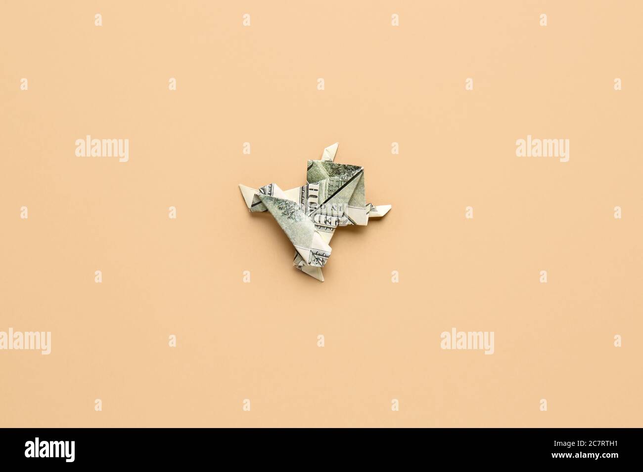 Origami frog made of dollar banknote on color background Stock Photo ...