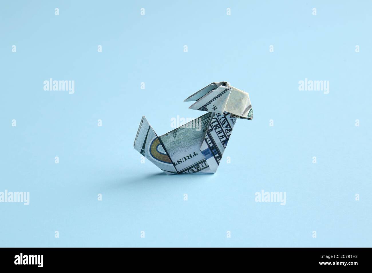 Origami rabbit made of dollar banknote on color background Stock Photo ...