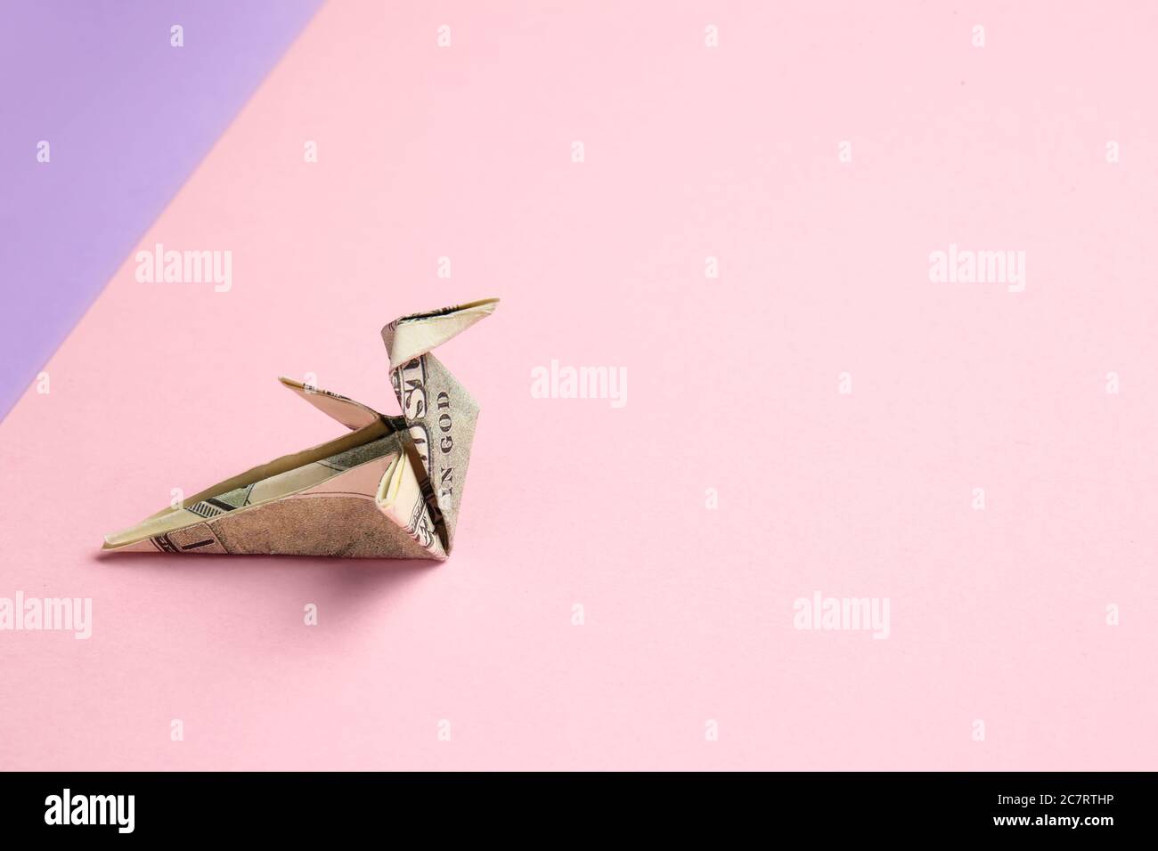 Origami bird made of dollar banknote on color background Stock Photo ...