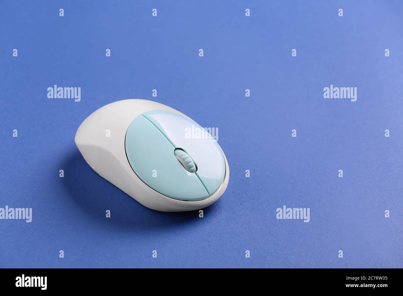 Modern computer mouse on color background Stock Photo - Alamy