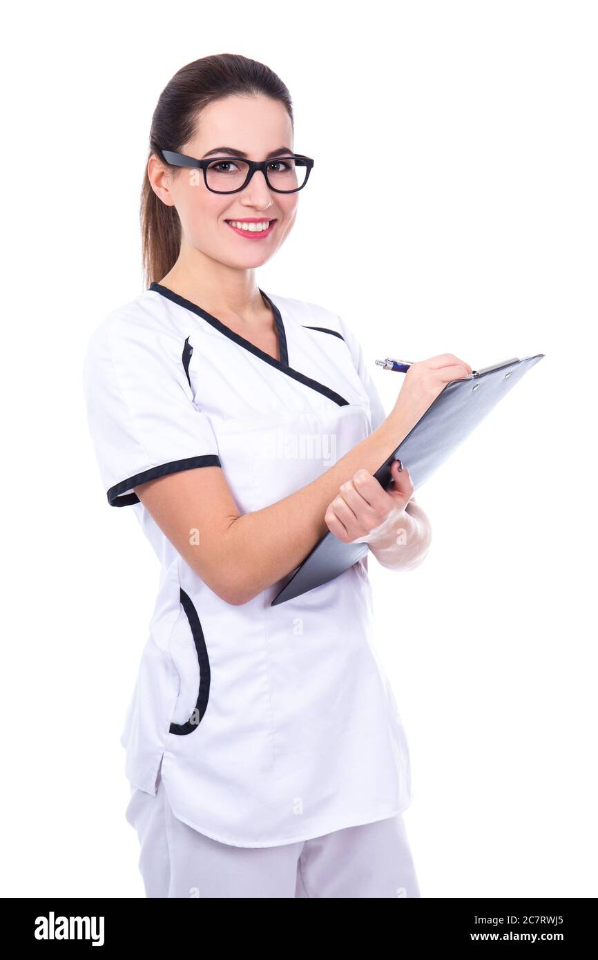young beautiful woman doctor writing something on clipboard isolated on ...