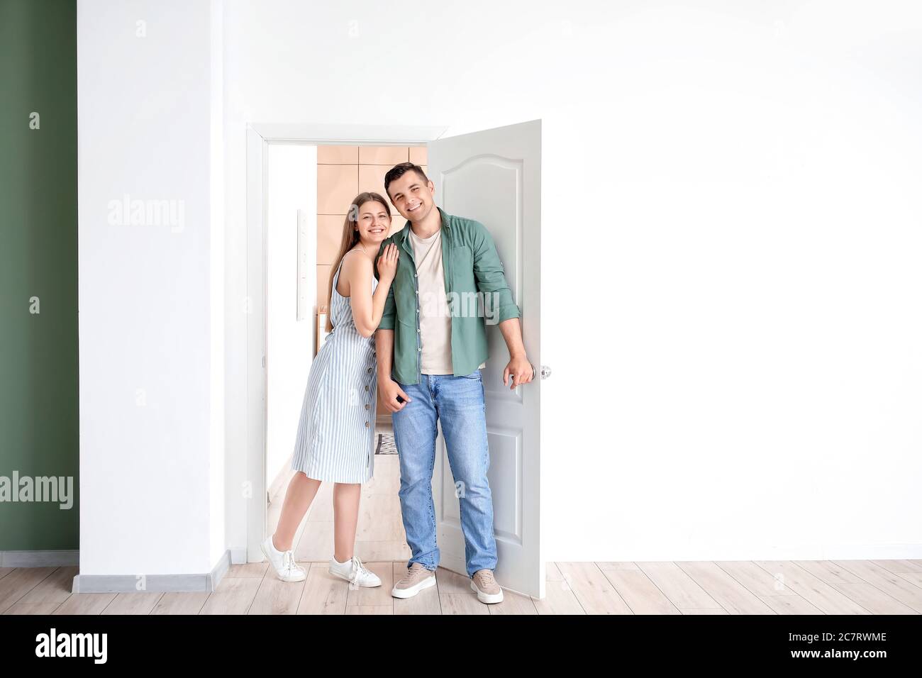 Man woman female couple entering front entrance hi-res stock ...