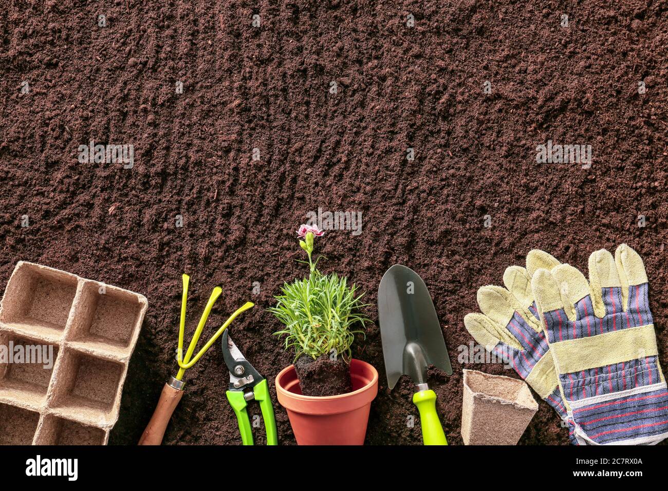 Set of gardening tools on soil Stock Photo - Alamy