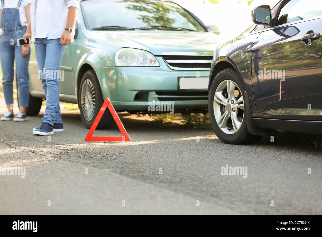 Emergency stop sign near broken cars after accident on road Stock Photo ...