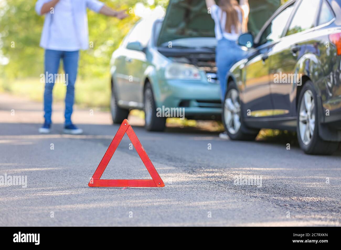 Emergency stop sign near broken cars after accident on road Stock Photo ...