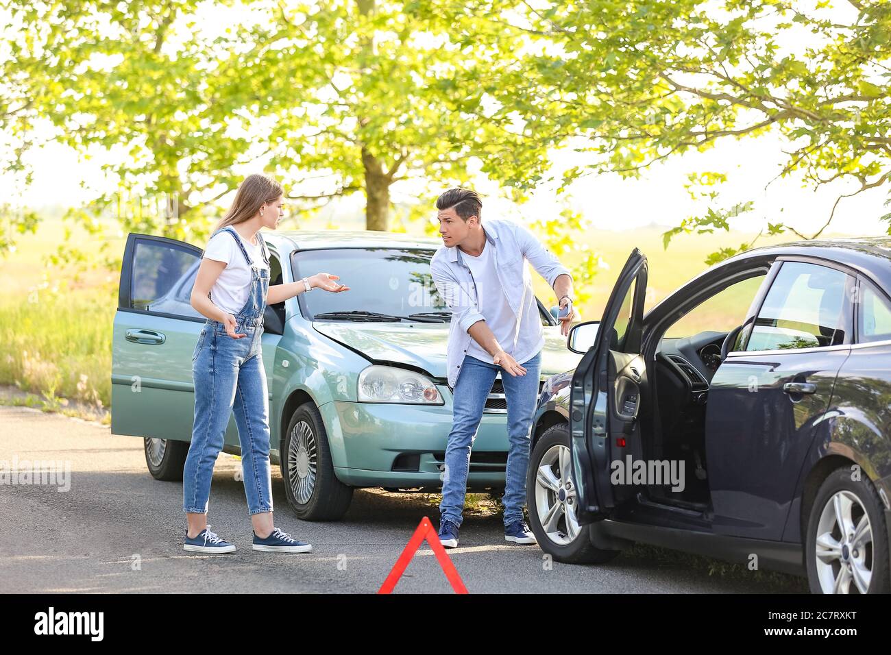 Stressed drivers near broken cars after accident Stock Photo - Alamy