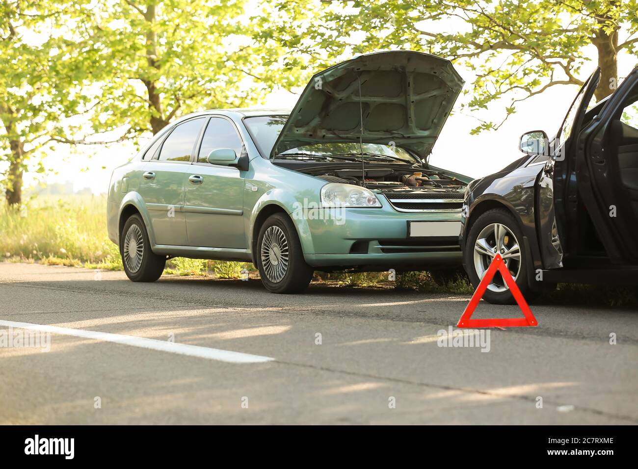 Emergency stop sign near broken cars after accident on road Stock Photo ...