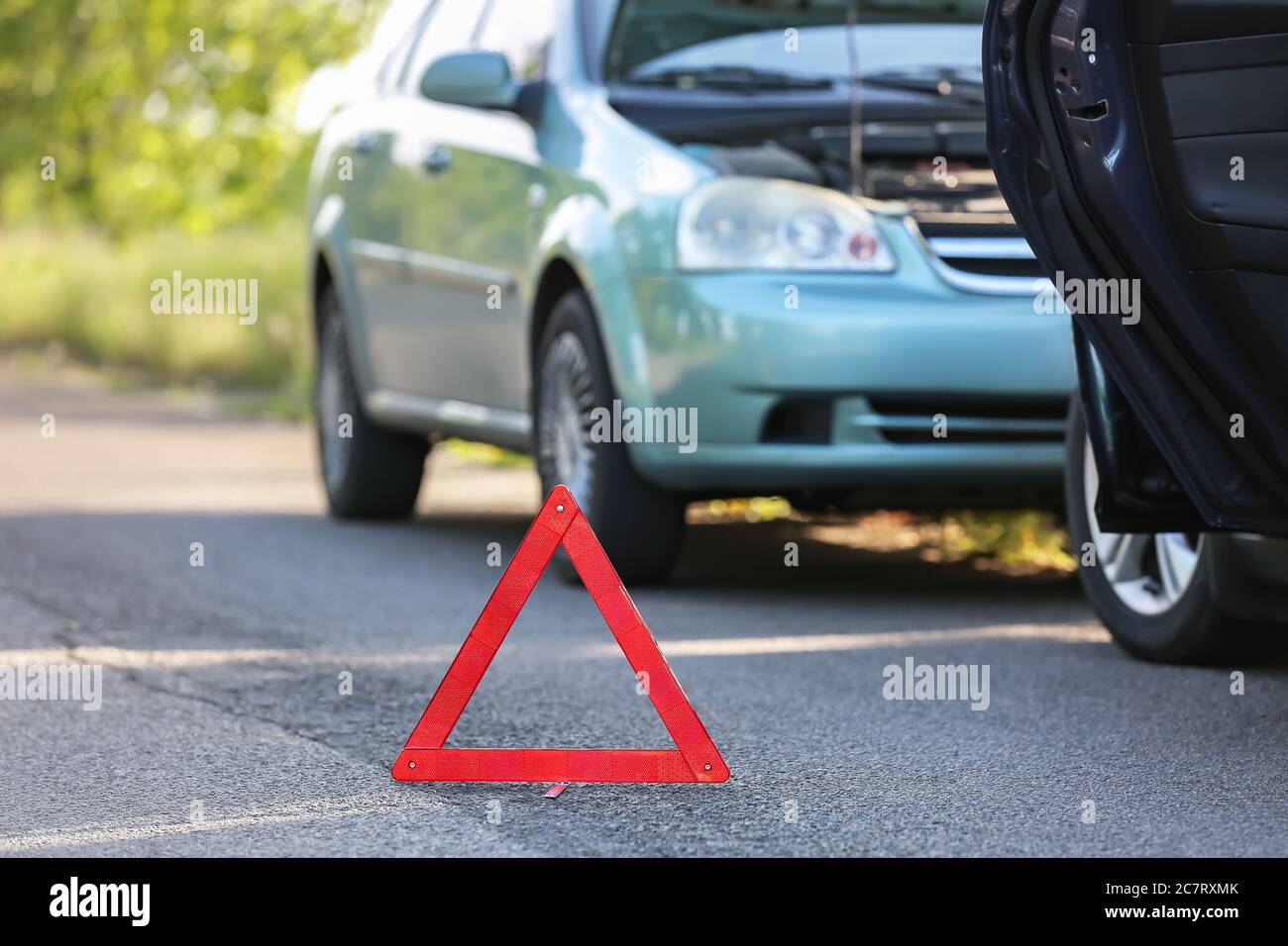 Emergency stop sign near broken cars after accident on road Stock Photo ...