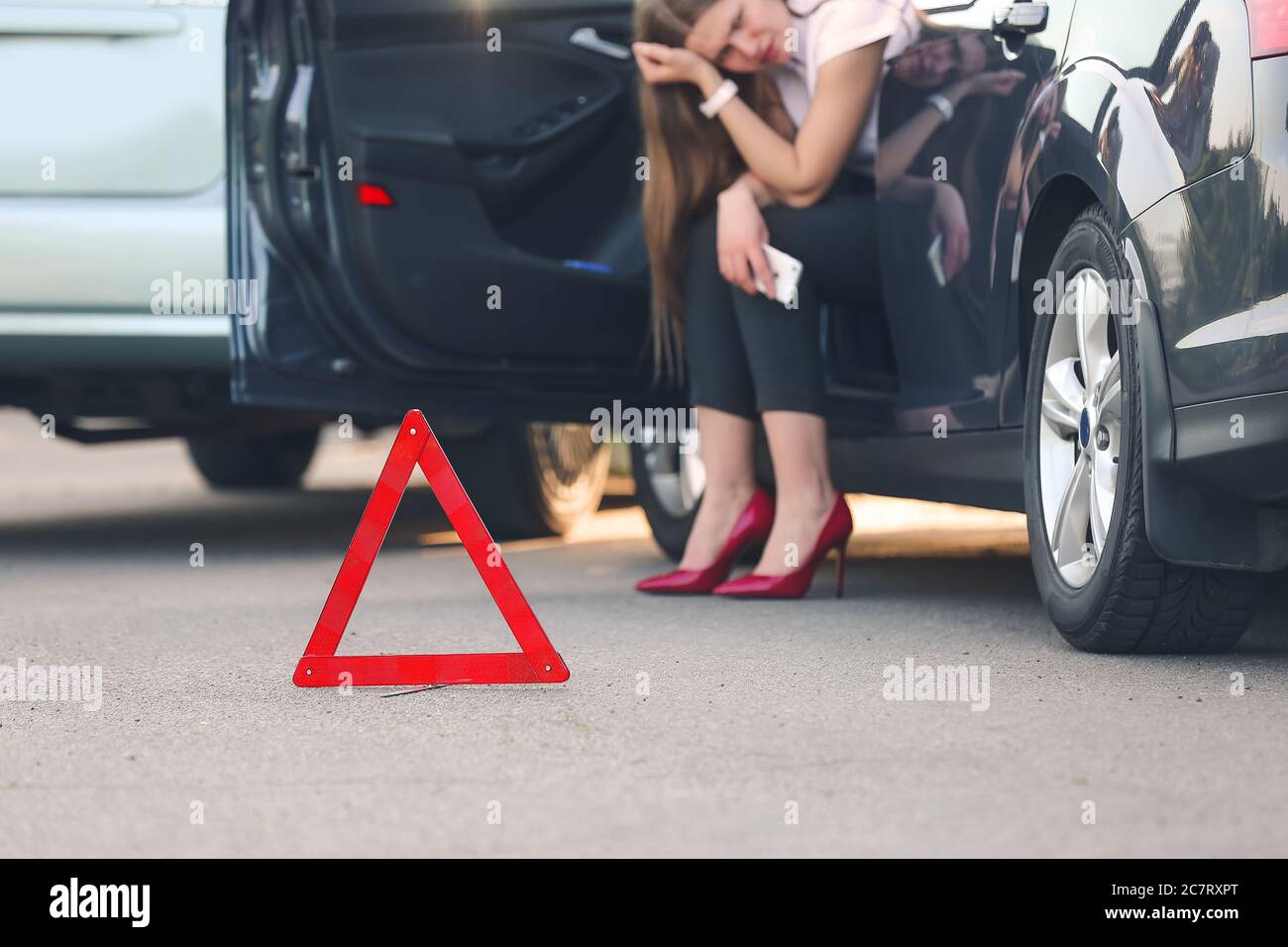 Emergency stop sign near broken cars after accident on road Stock Photo ...