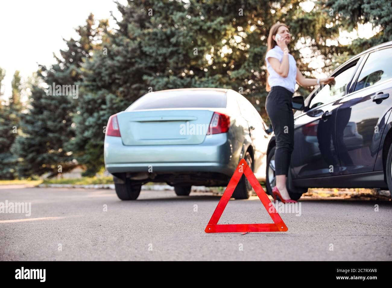Emergency stop sign near broken cars after accident on road Stock Photo ...