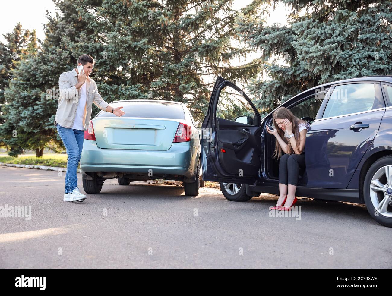 Stressed drivers after car accident on road Stock Photo - Alamy