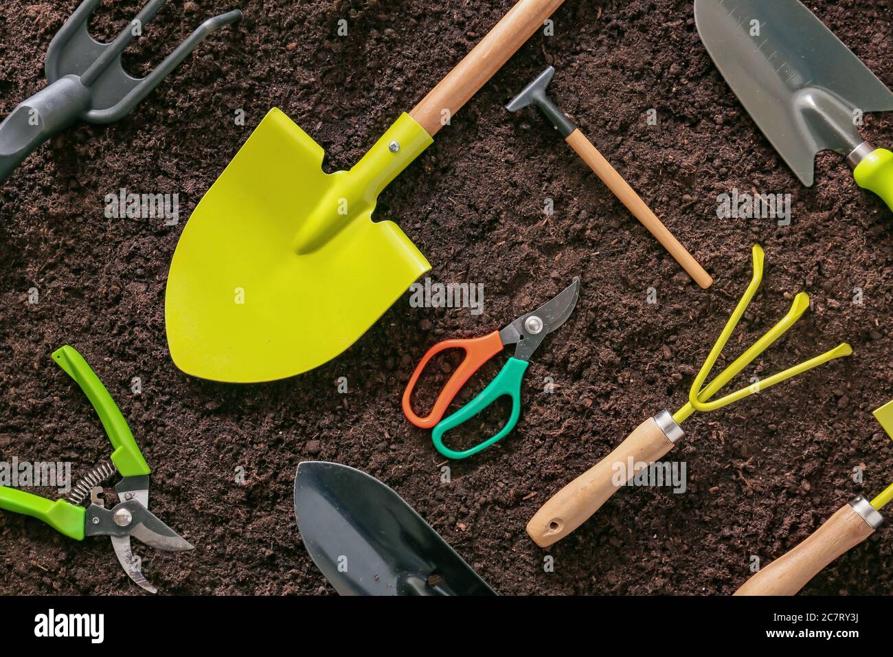 Tools for gardening on soil background Stock Photo - Alamy
