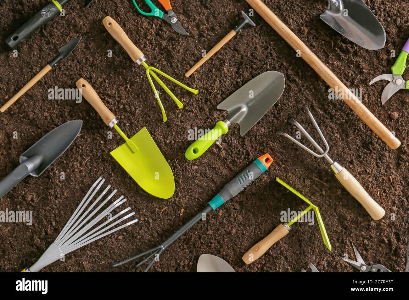 Tools for gardening on soil background Stock Photo - Alamy