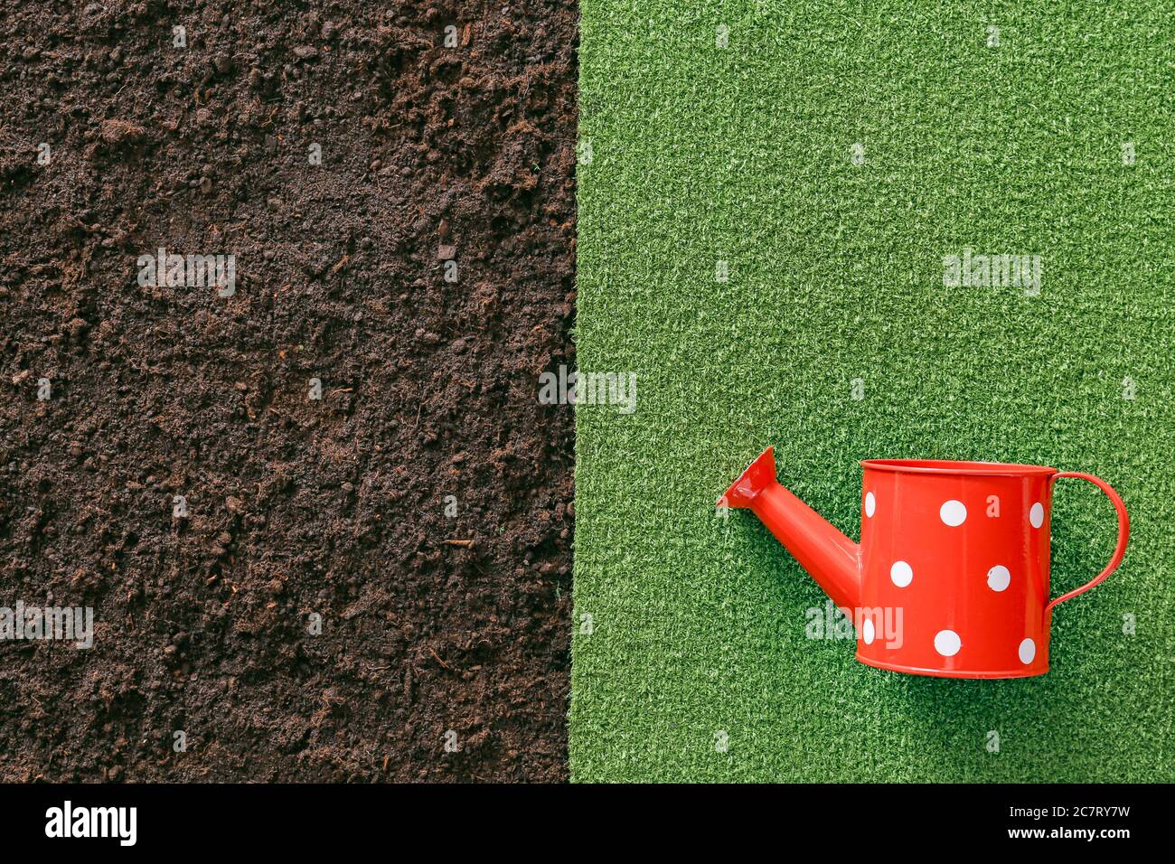 Watering can for gardening with soil, top view Stock Photo - Alamy