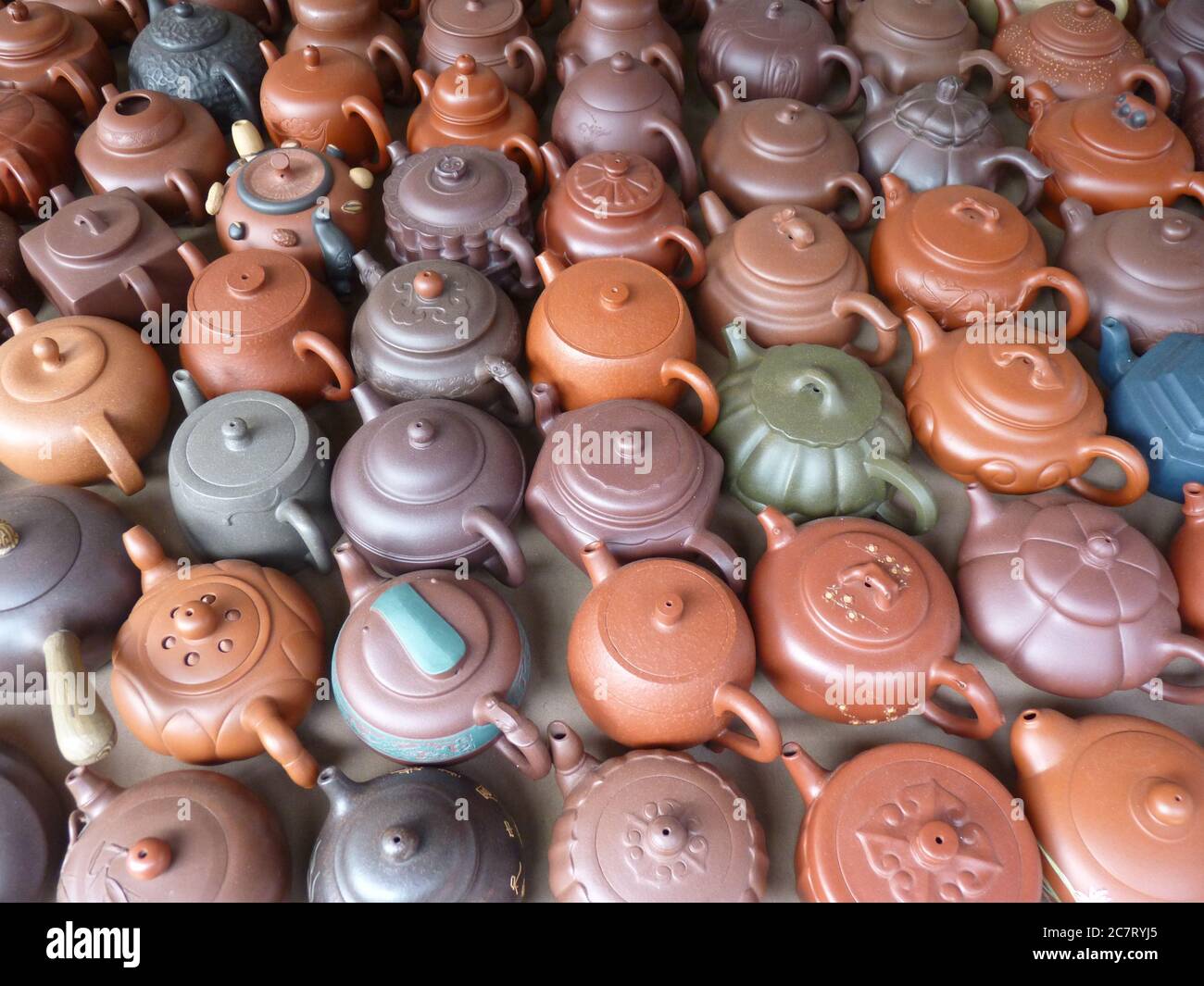 High angle shot of colorful teapots in rows in the market Stock Photo ...