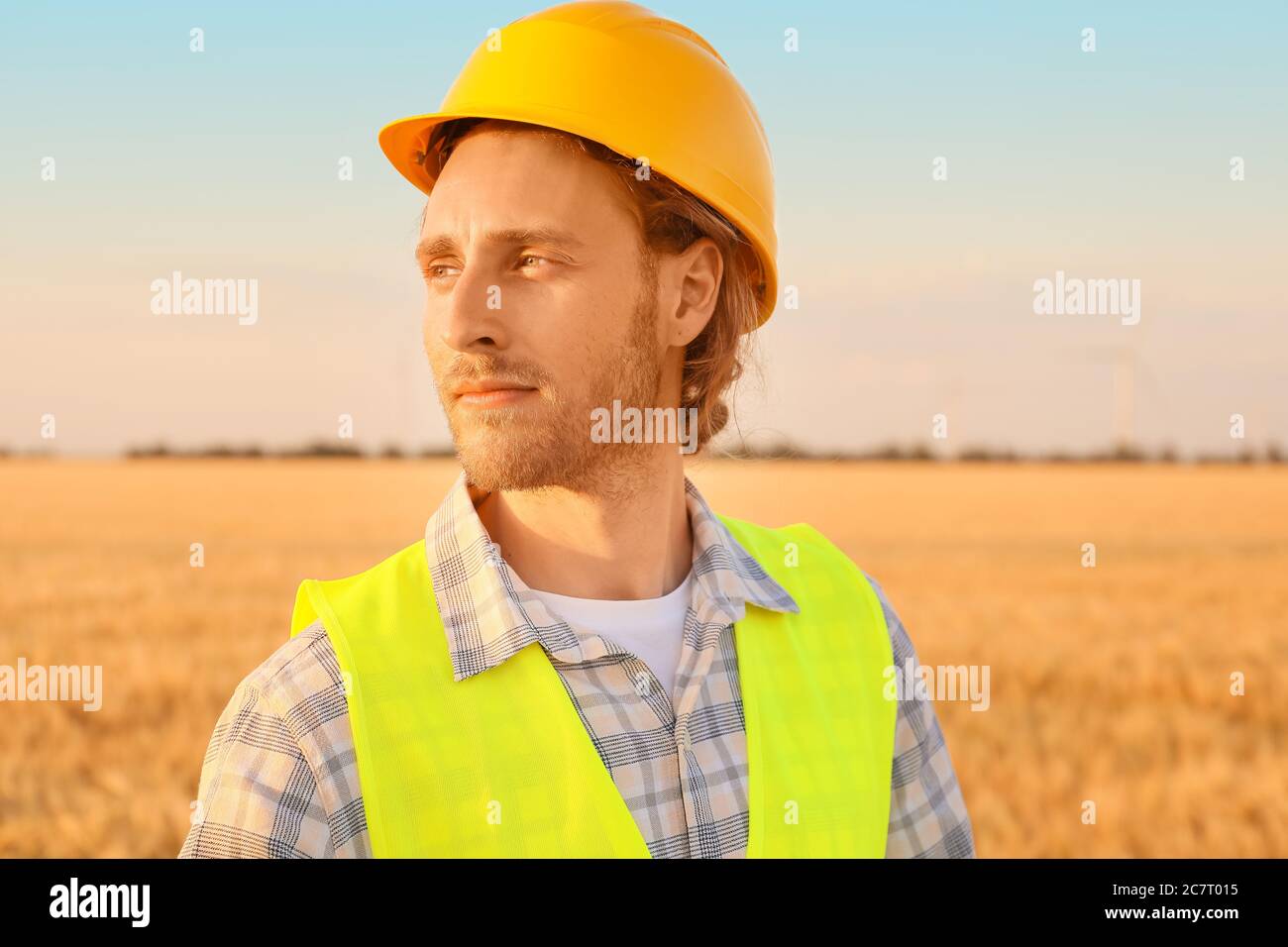 Male engineer on windmill farm for electric power production Stock ...