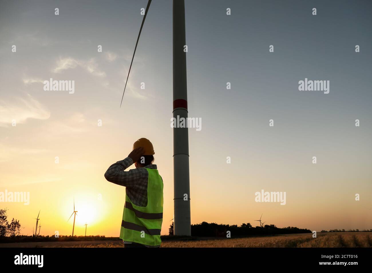 Male engineer on windmill farm for electric power production Stock ...