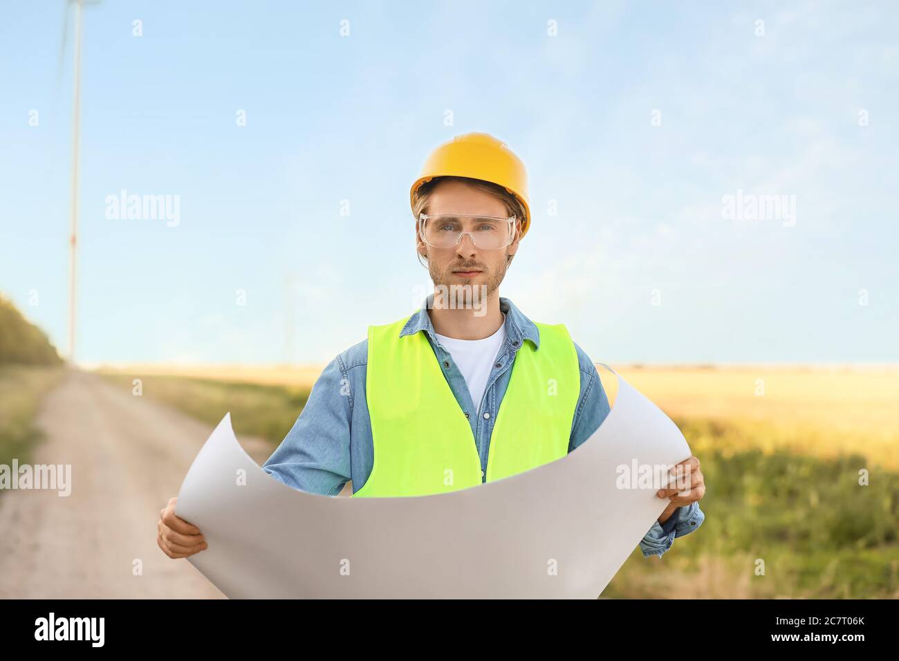 Male engineer on windmill farm for electric power production Stock ...