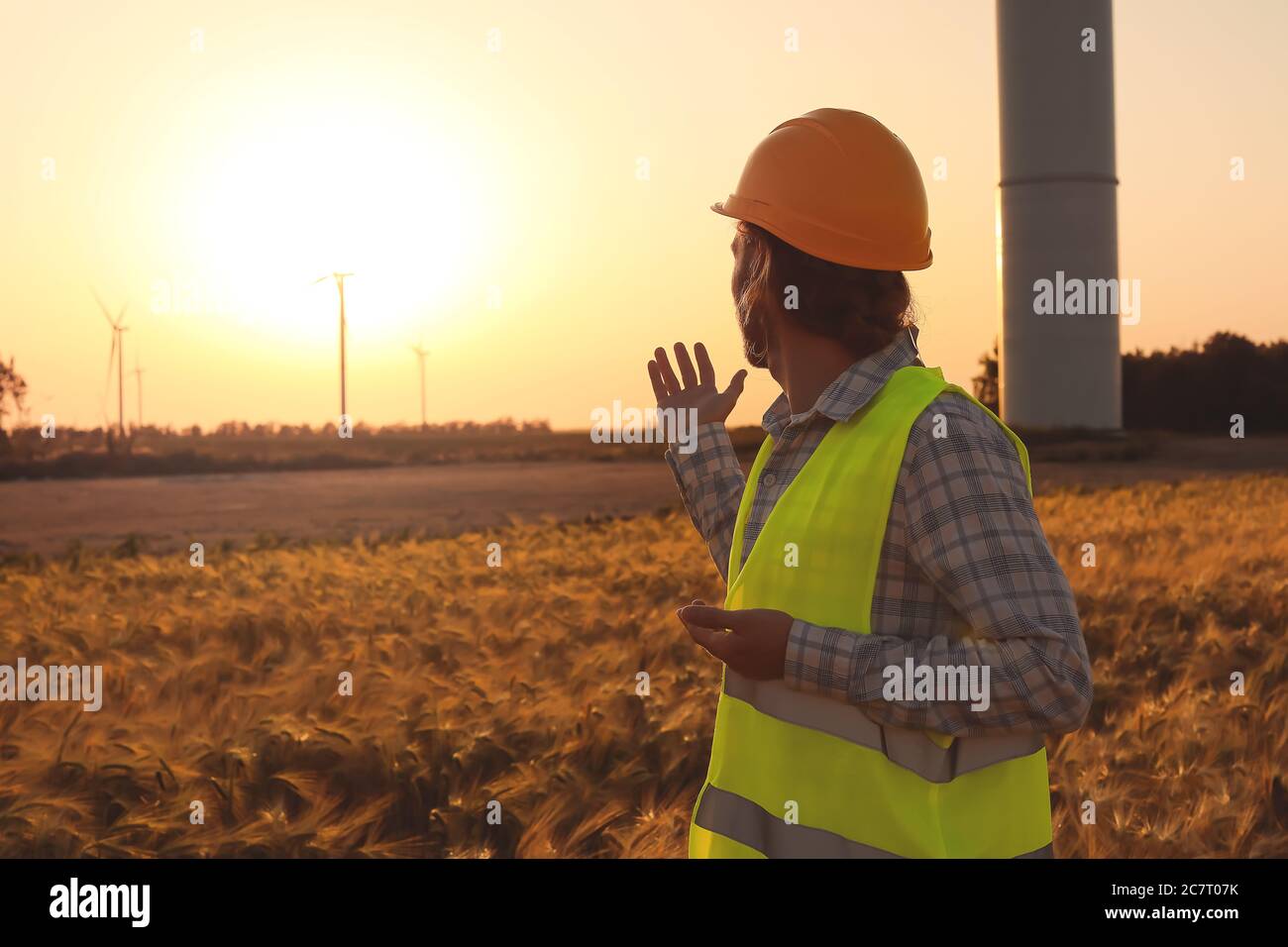 Male engineer on windmill farm for electric power production Stock ...