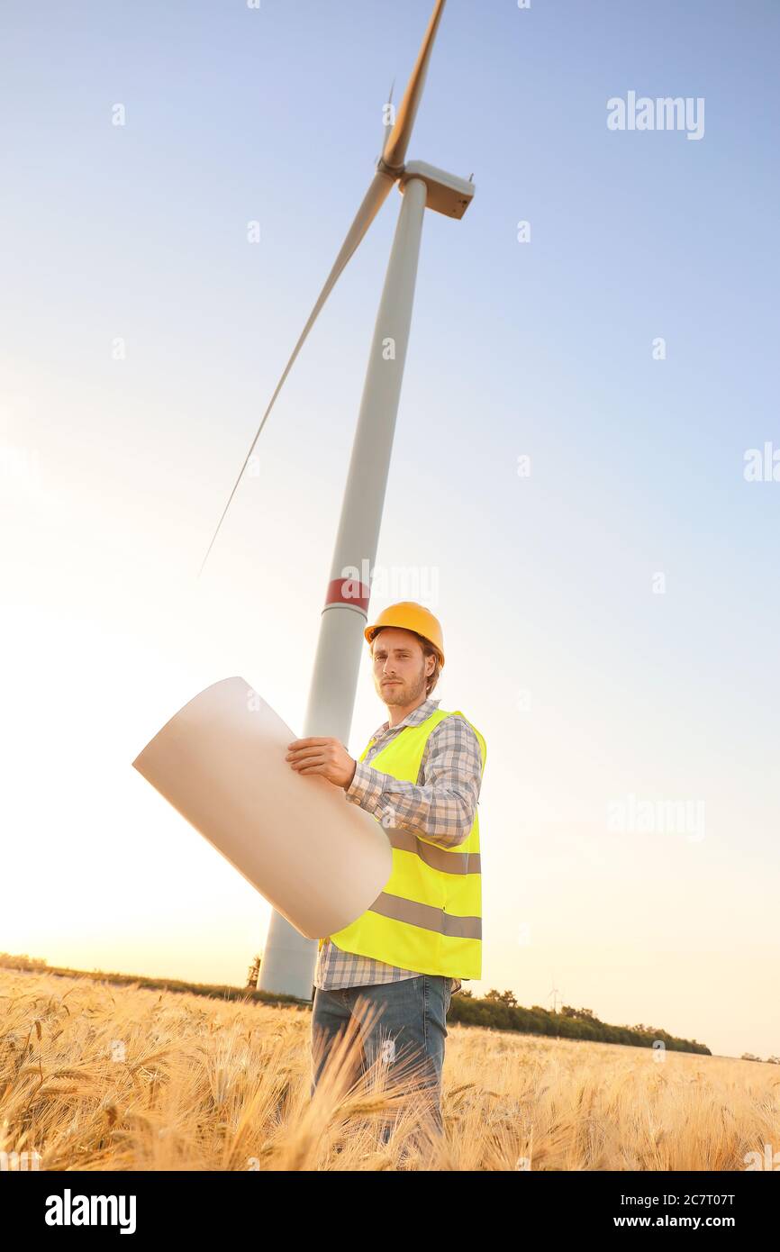 Male engineer on windmill farm for electric power production Stock ...