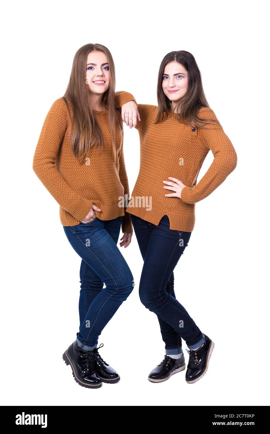 friendship concept - full length portrait of two girls posing isolated ...