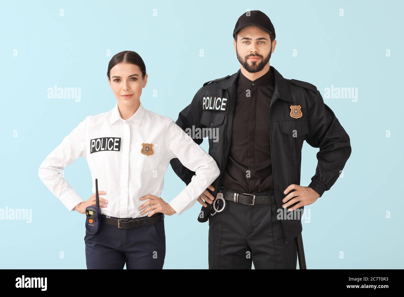 Police officers on light background Stock Photo - Alamy