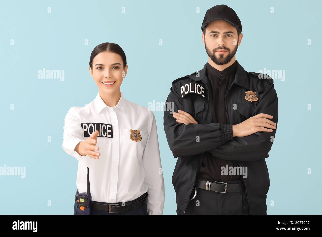 Police officers on light background Stock Photo - Alamy