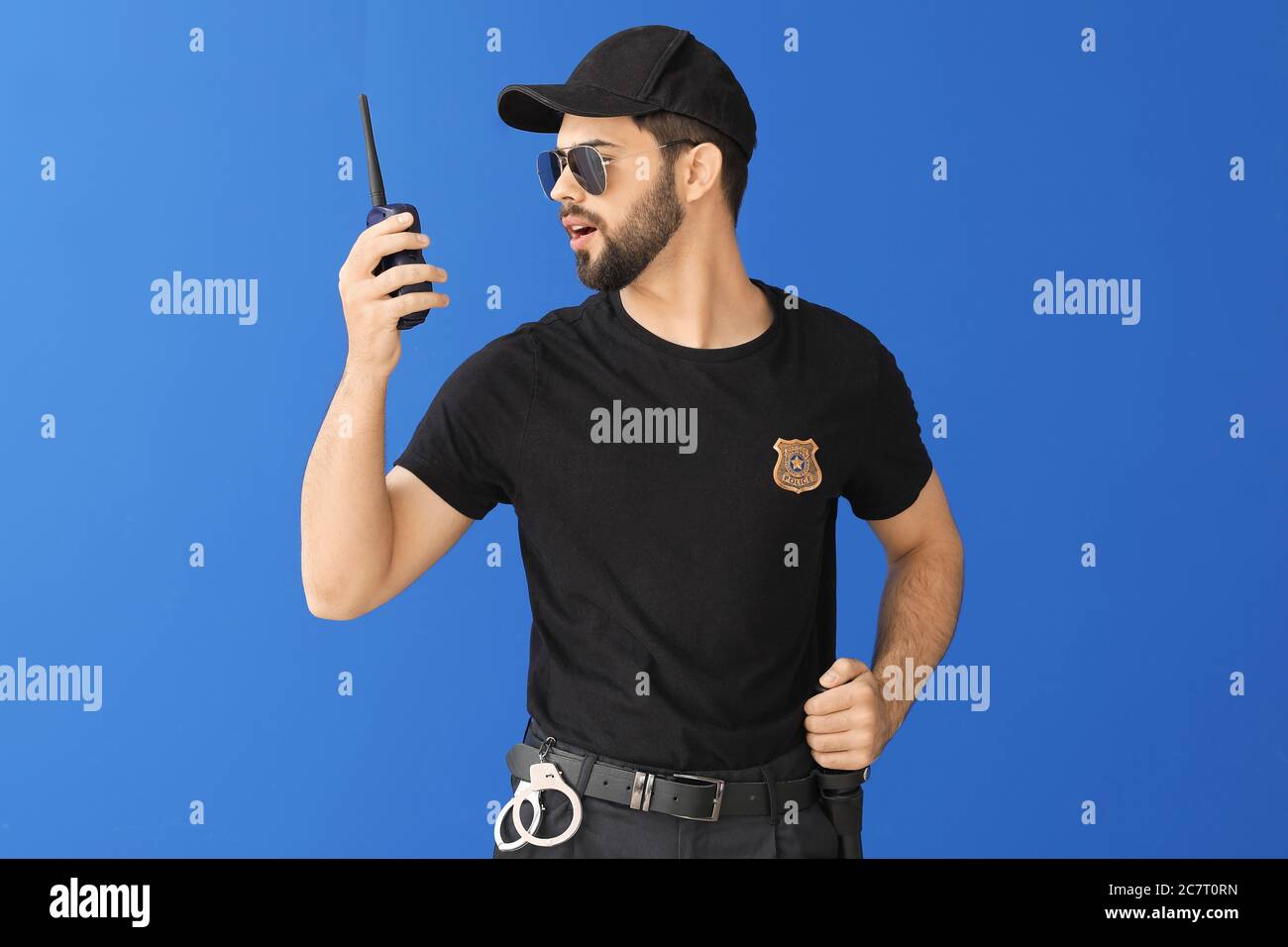 Policeman on his radio hi-res stock photography and images - Alamy