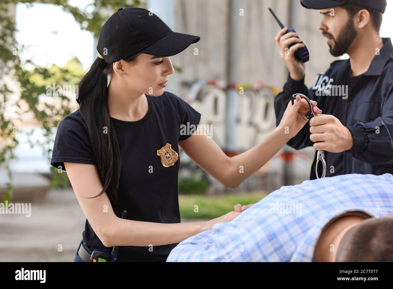 Female police officer arresting woman hi-res stock photography and ...