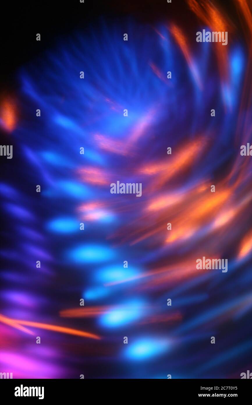 Vertical shot of staggered and refracted light layers vortex light ...