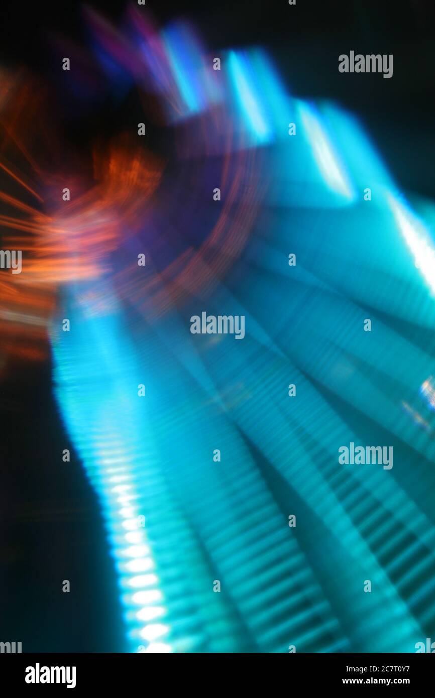 Vertical shot of staggered and refracted light layers vortex light ...