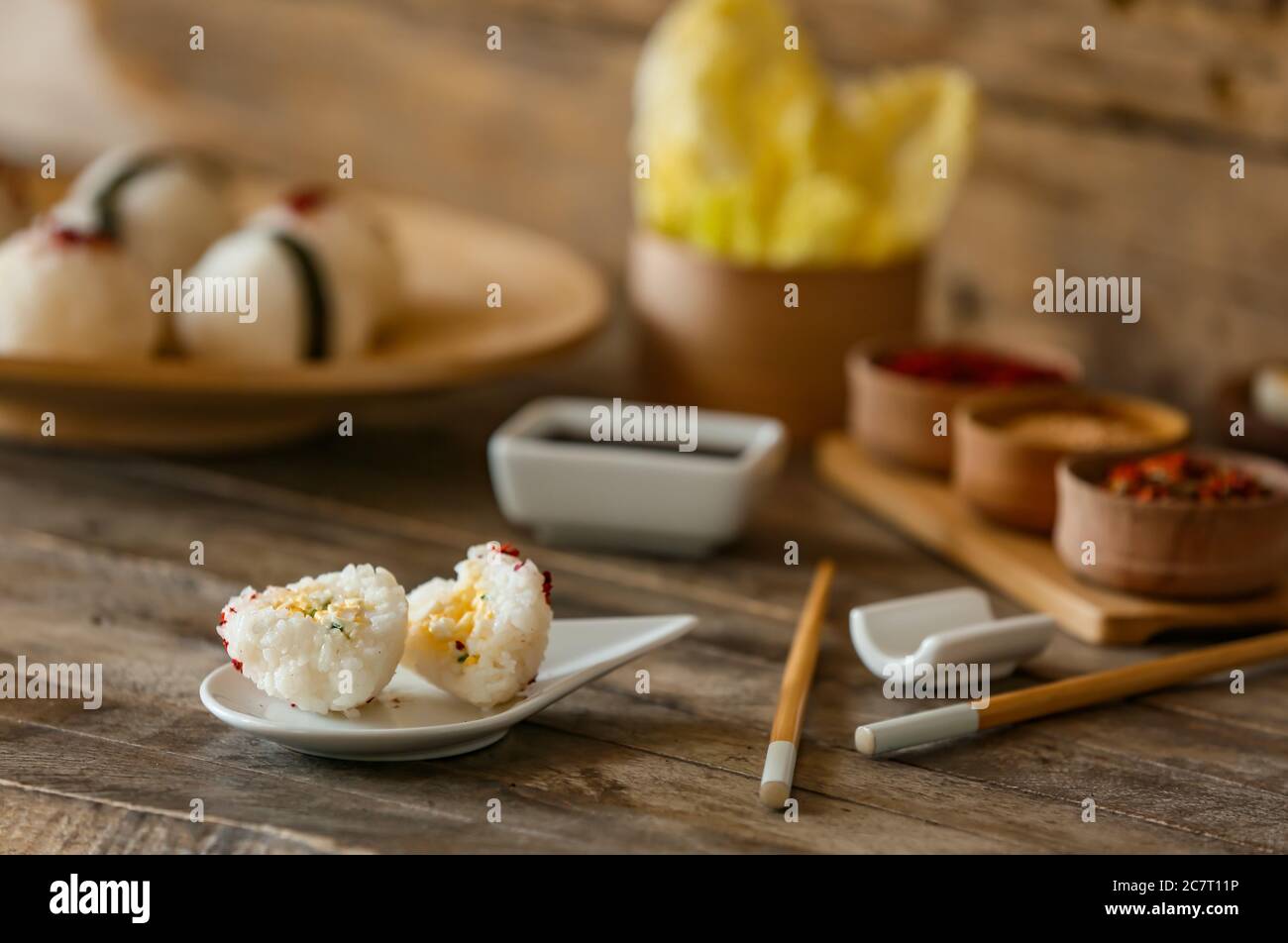 Plate with traditional Japanese onigiri on table Stock Photo - Alamy