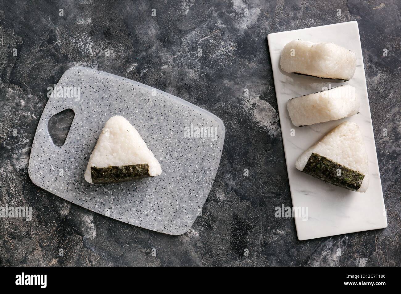 Traditional Japanese onigiri on grey background Stock Photo - Alamy