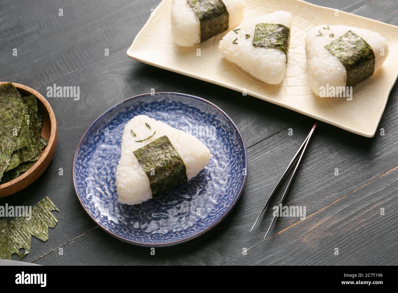 Traditional Japanese onigiri with nori on table Stock Photo - Alamy